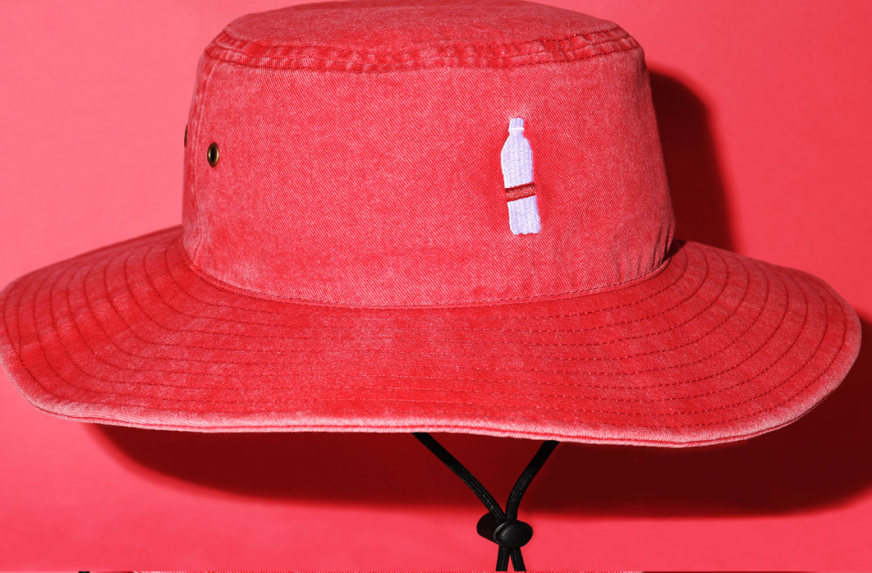 Not just for fishermen – our red bucket hat for Rivella. | bb trading